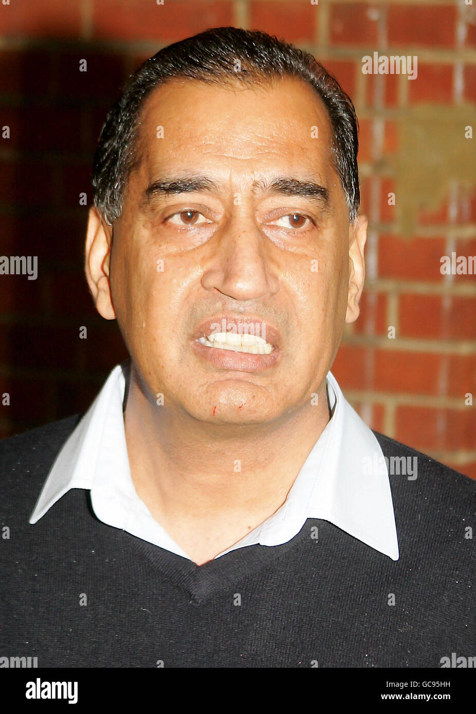 Businessman Munir Hussain arrives back at his home in Desborough Park ...