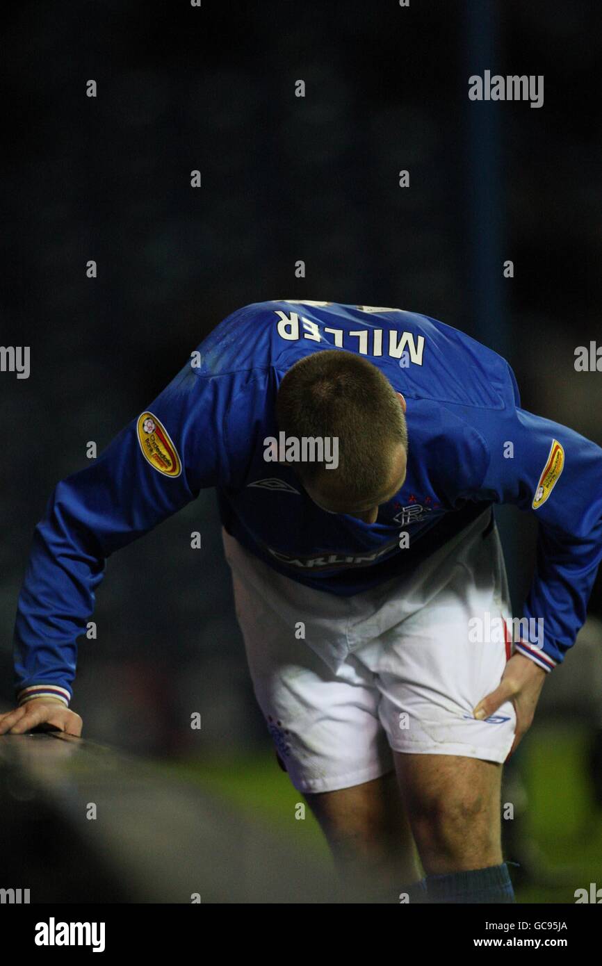 Rangers Kenny Miller holds his leg after an injury during the Scottish ...