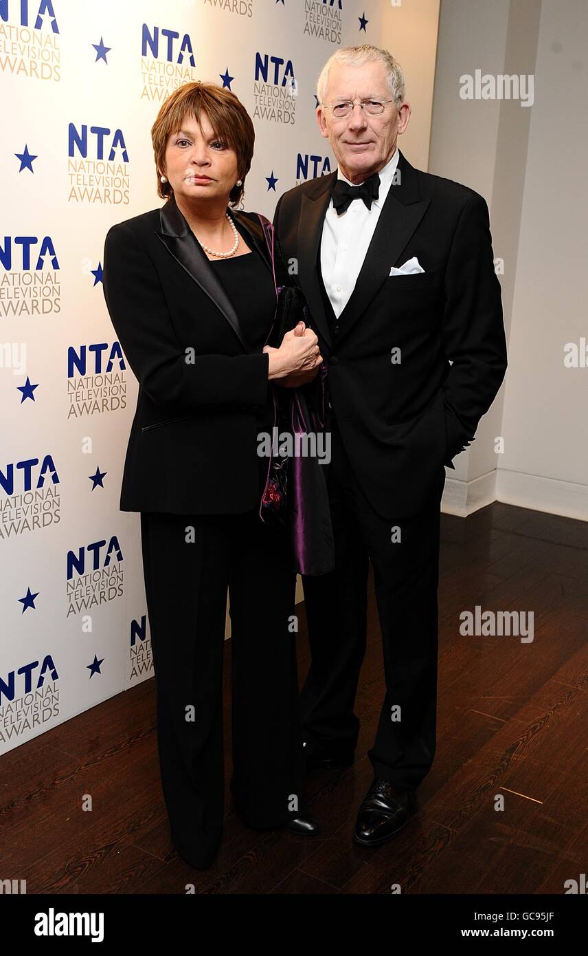 Nick Hewer and his partner Catherine arriving for the National ...