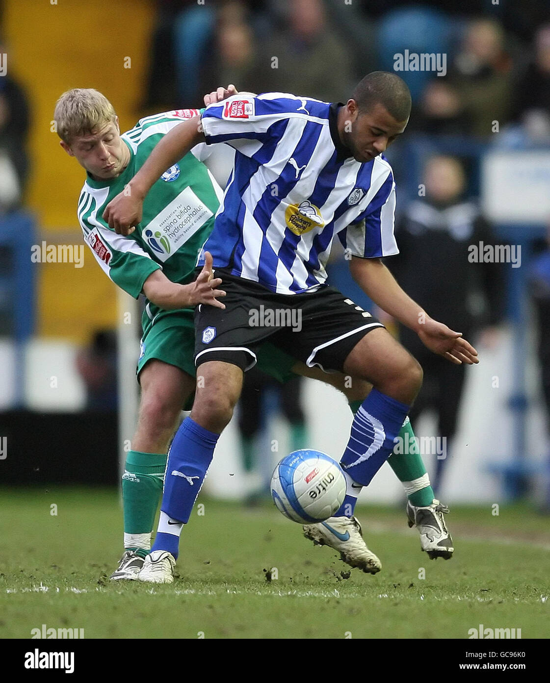 Peterborough United's Scott Griffiths and Sheffield Wednesday's Tom ...