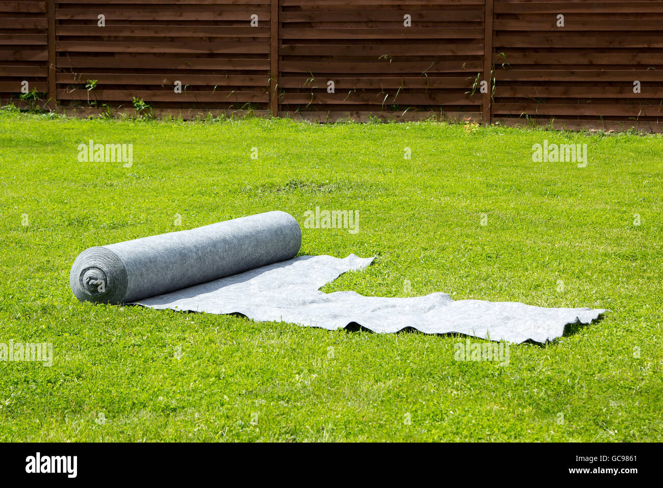 gray geotextile roll lying on the lawn Stock Photo - Alamy