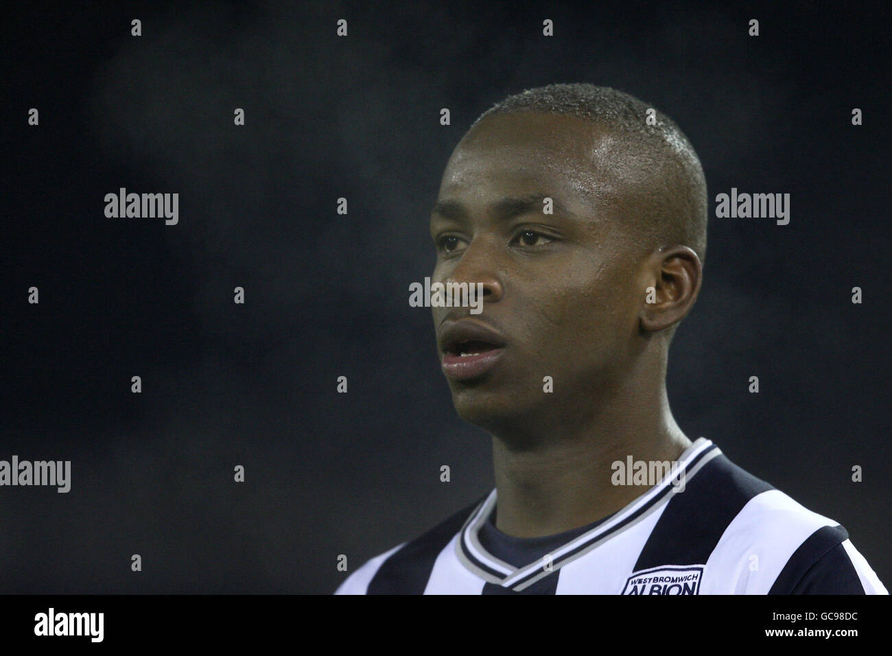 Football head shot headshot portrait mouth open shaved head ...