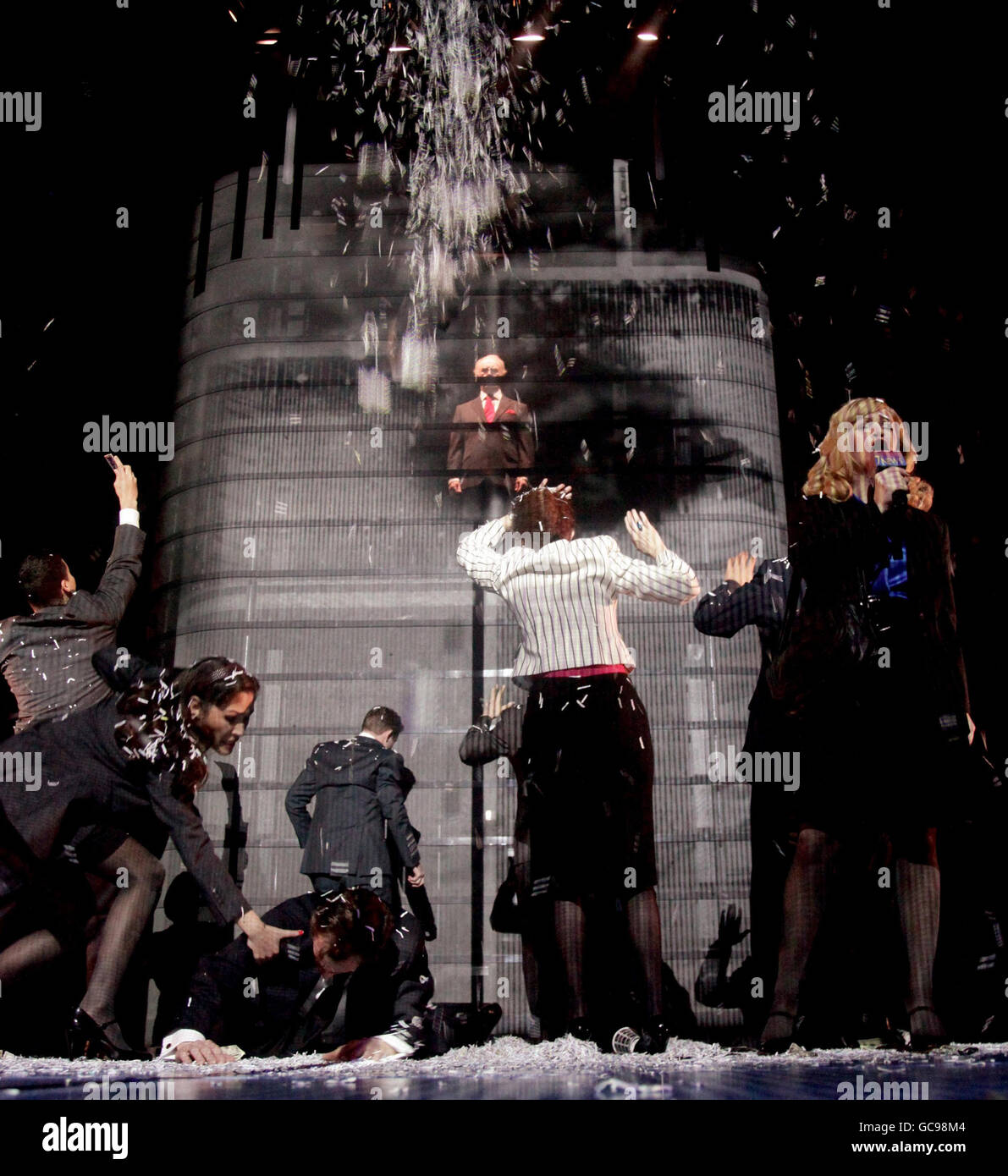 Members of the cast on stage during a photocall for the play Enron ...