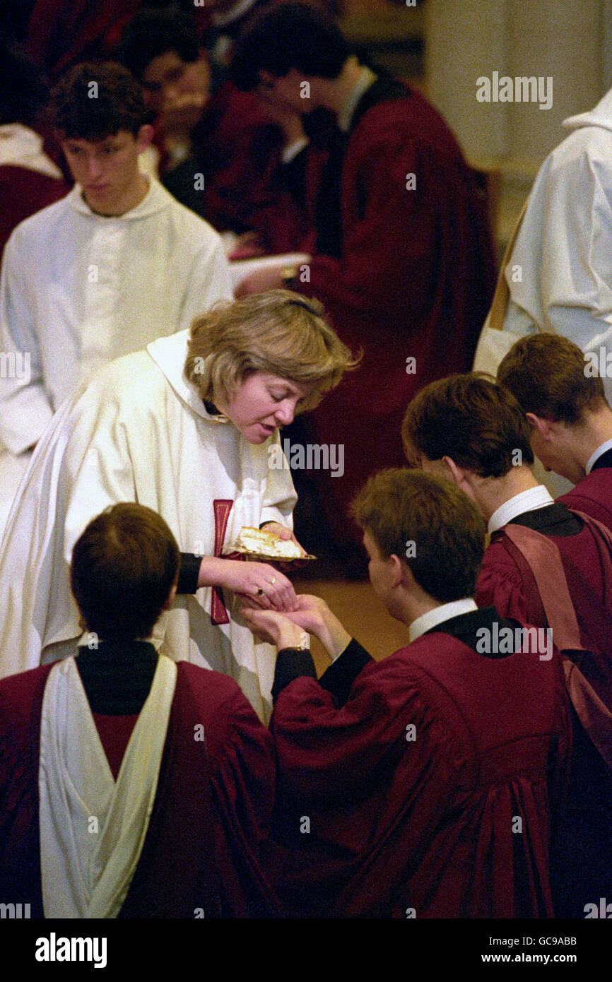 Female priest Angela Berners-Wilson gives out the bread during ...
