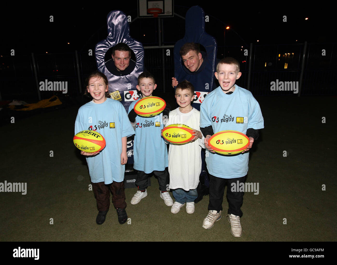Jon Welsh and Moray Low take kids in a session of street rugby during ...