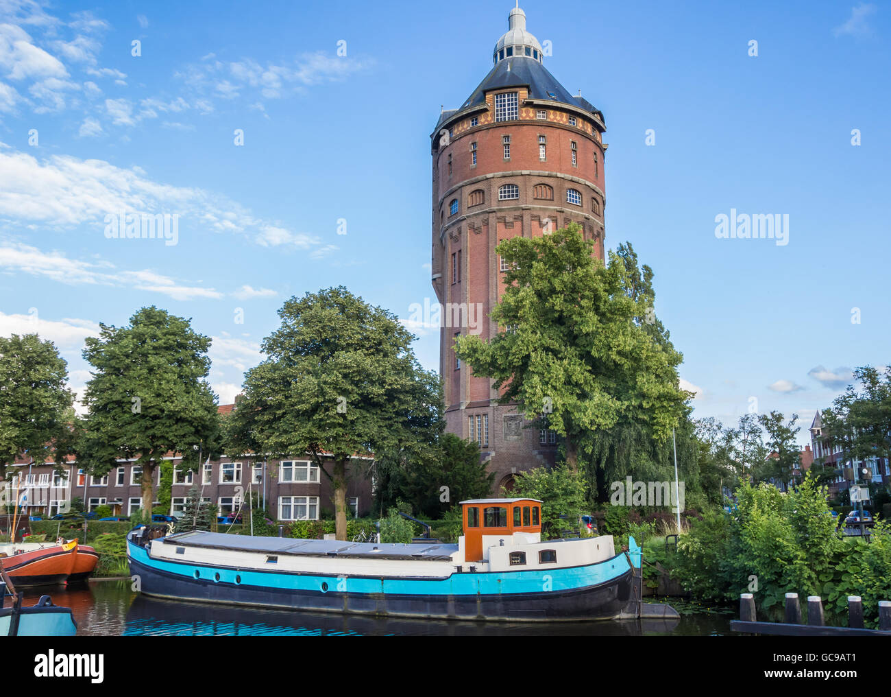 Old water tower at a canal in Groningen, The Netherlands Stock Photo ...