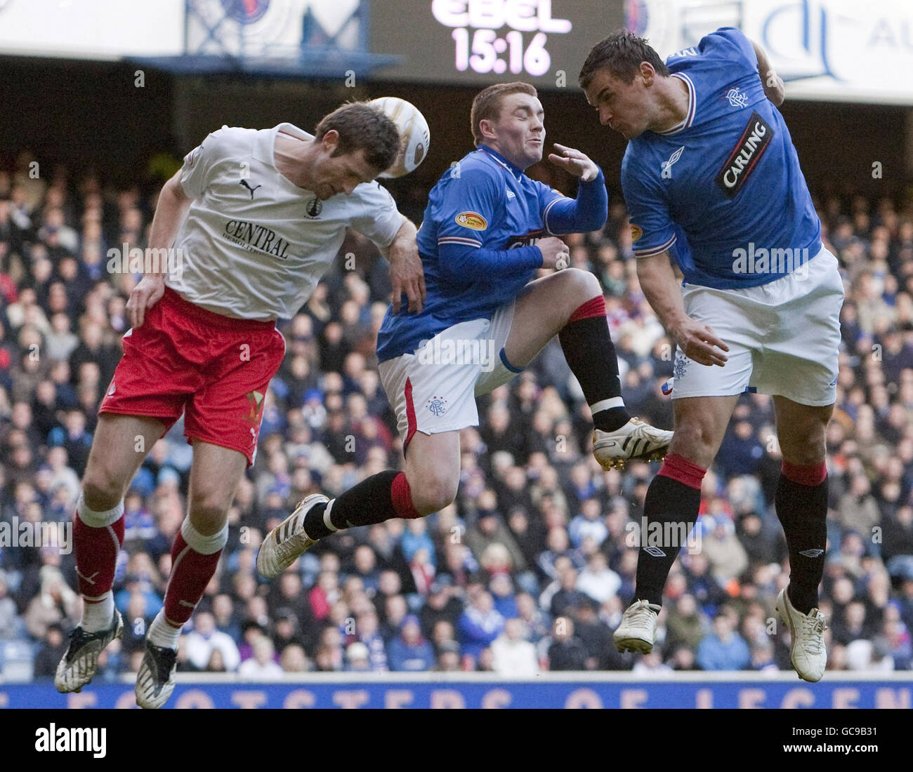 Falkirk's Brian McLean (left) battles for a ball in the air with ...