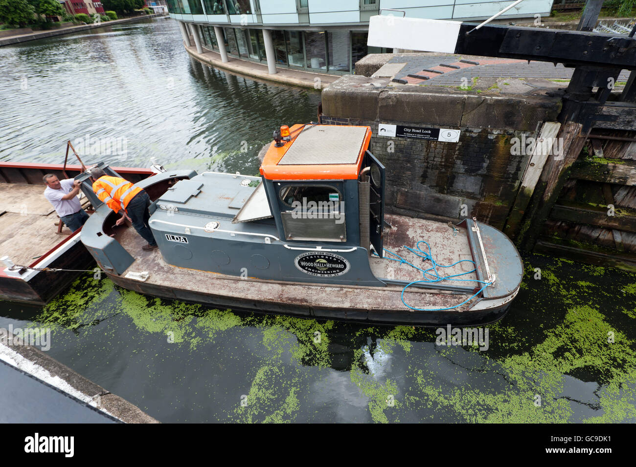 Bantam tug Ilda leaving City Road Lock, on the Regents Canal, pushing ...