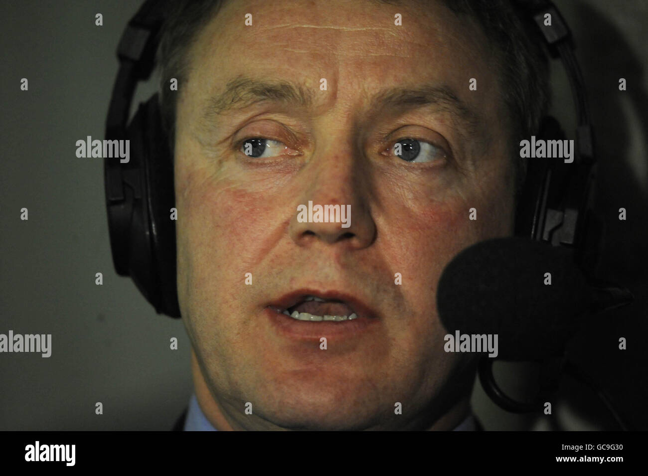 Notts County's Chairman Peter Trembling wears headphones to give a ...