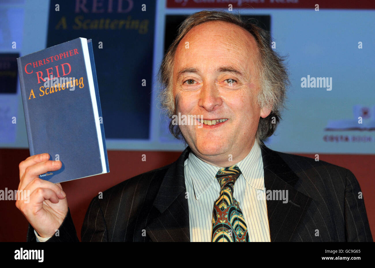 Christopher Reid with his collection of poems, A Scattering, after he ...