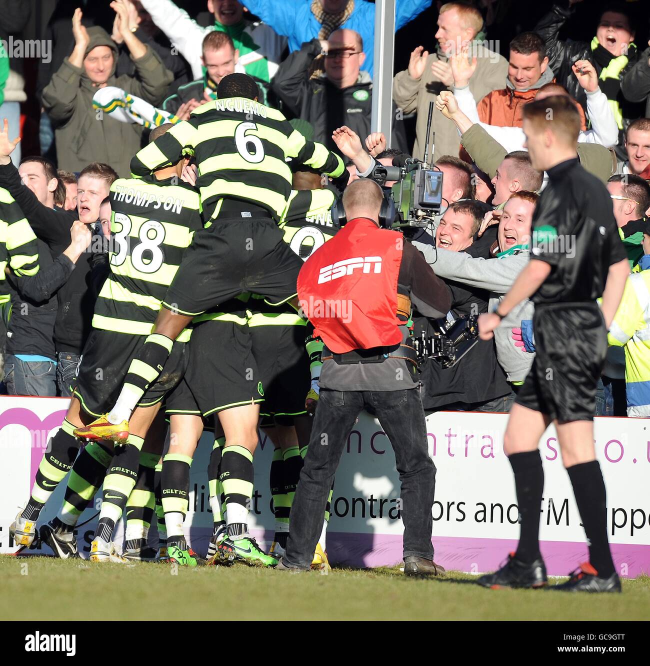 Celtic's Morten Rasmussen (obscured) is mobbed by teammates after ...