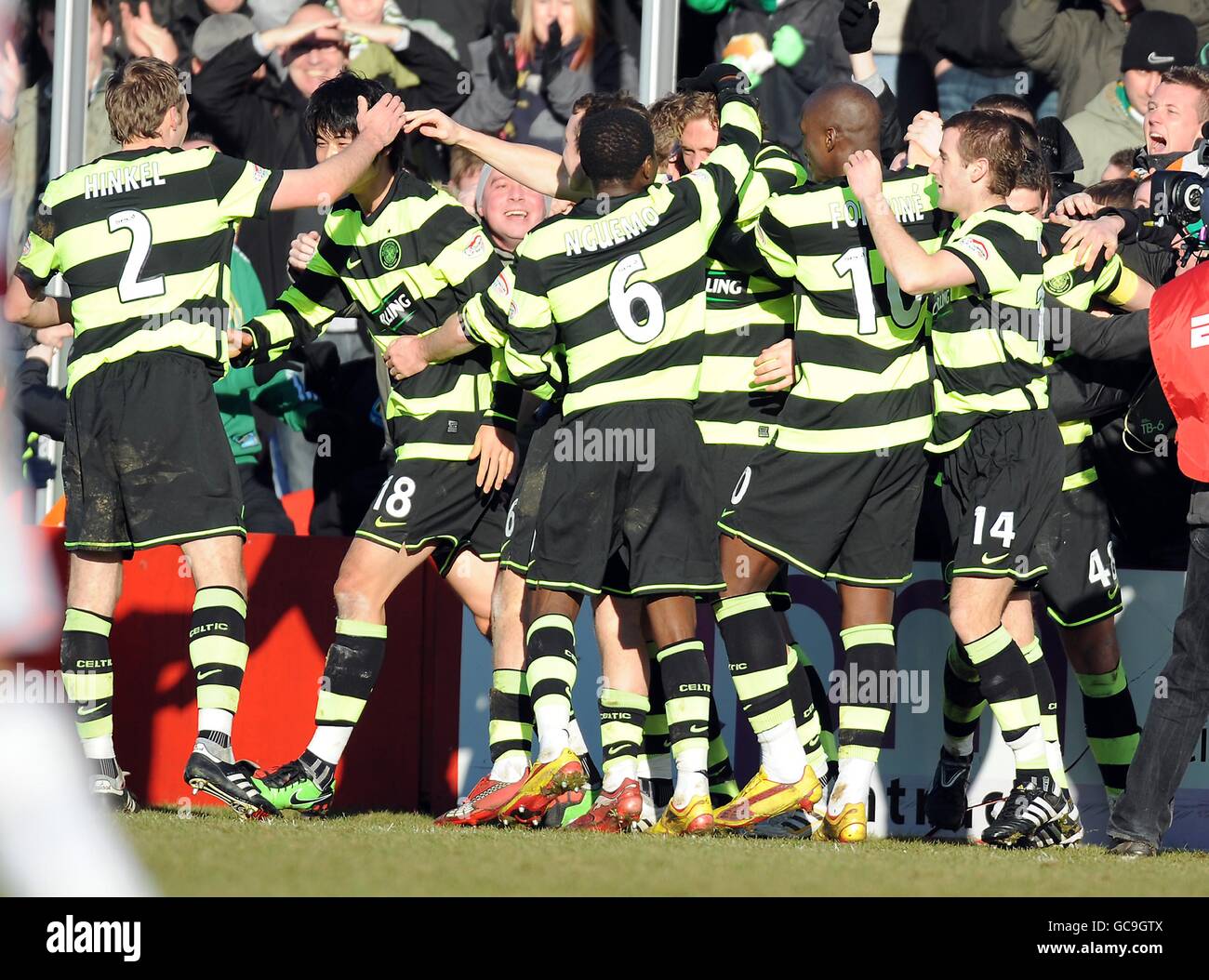 Celtic's Morten Rasmussen (obscured) is mobbed by teammates after ...