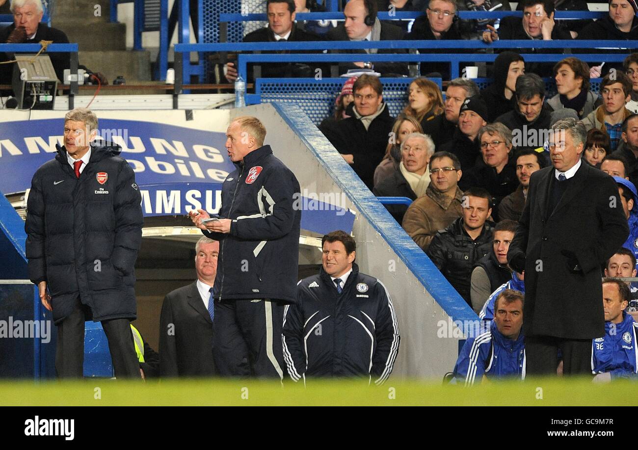 Arsenal manager Arsene Wenger (left) speaks to fourth official Peter ...
