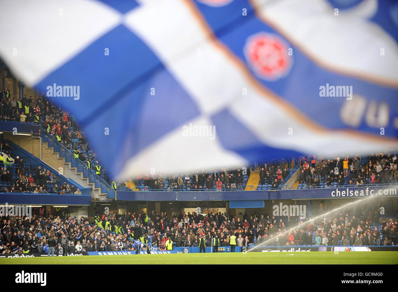 Stamford bridge chelsea fans in the stands wave a flag hi-res stock ...