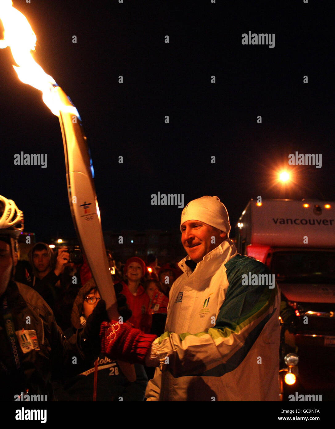 Martyn Ziegler carries the Olympic Torch on the streets of White Rock ...