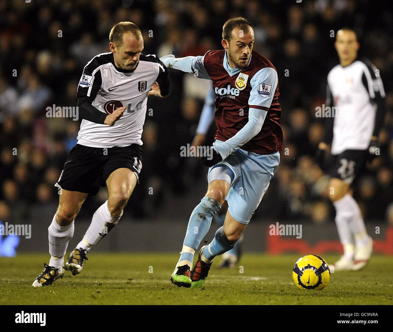 Fulham's Danny Murphy (left) and Burnley's Steven Fletcher (right) in ...