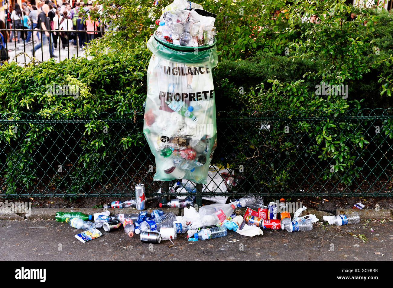 full trash can in Paris, Montmartre Stock Photo - Alamy
