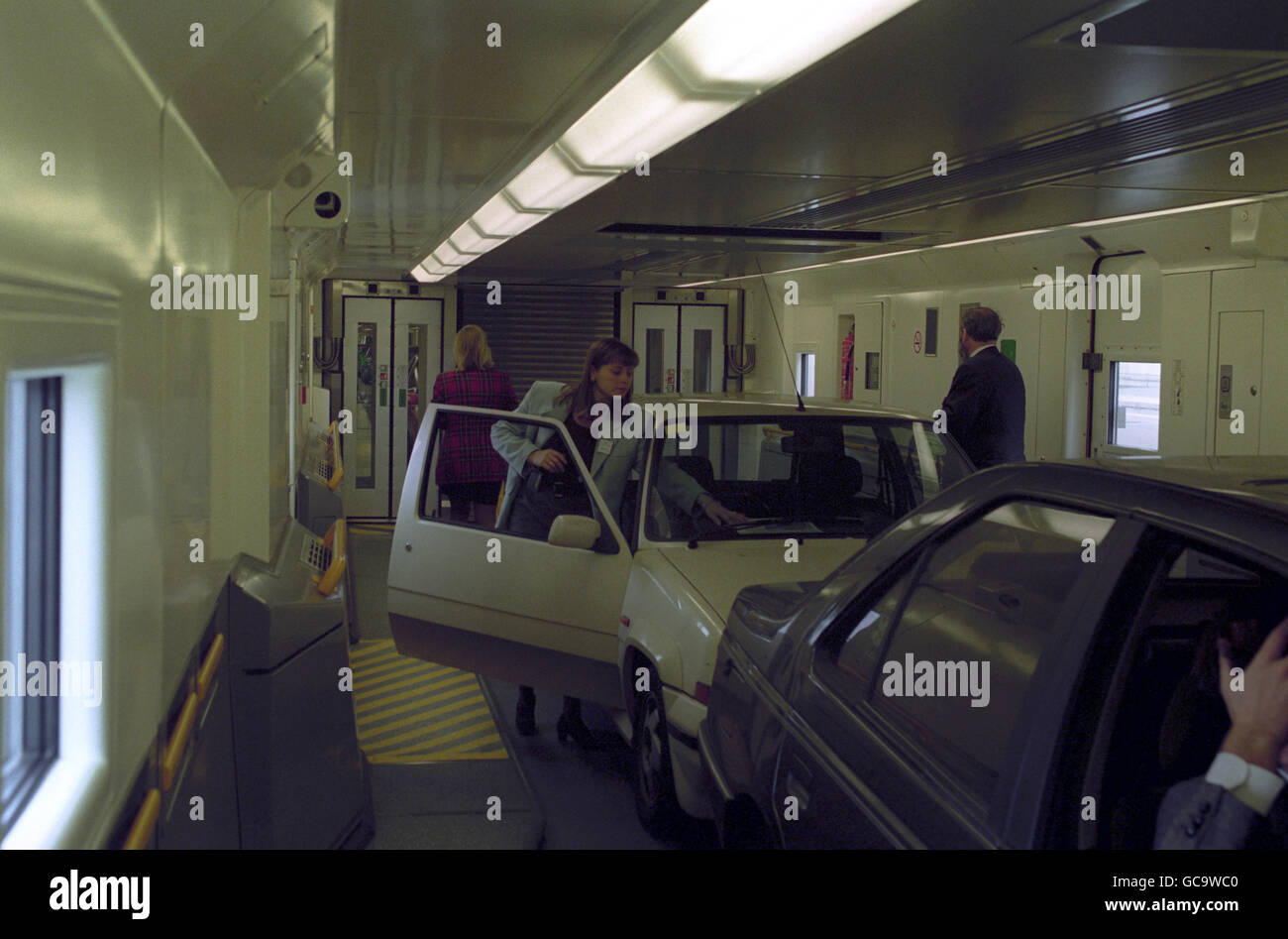 Car driving passengers leave their cars inside one of the carriages of ...
