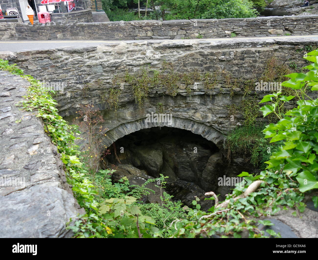 The cave beneath a bridge Stock Photo - Alamy