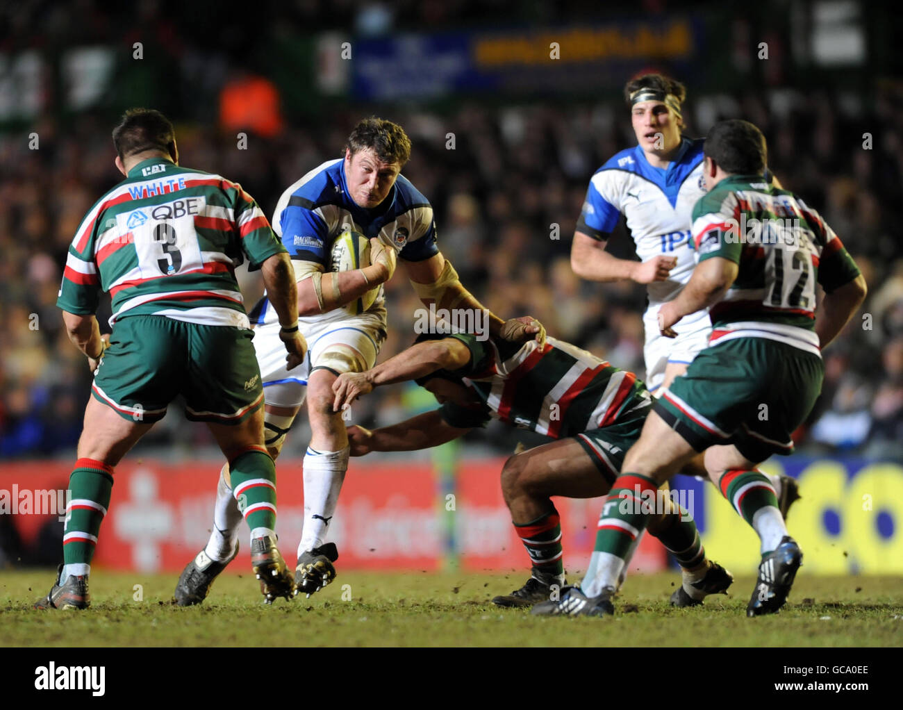 Bath Rugby's Peter Short (second left) is tackled by Leicester Tigers ...