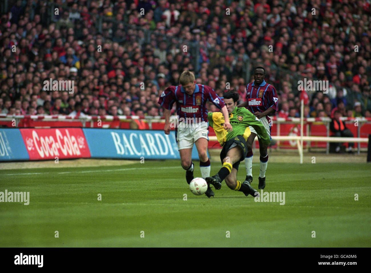 Manchester United's Ryan Giggs (r) challenges Aston Villa's Graham ...