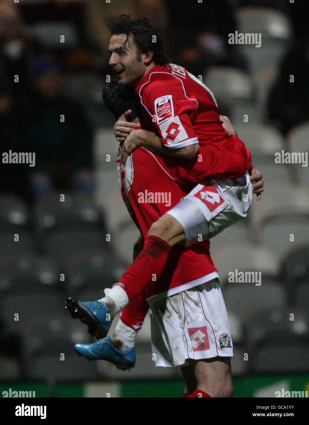 Barnsley's Felipe Teixeira (right) congratulates team mate Andy Gray ...