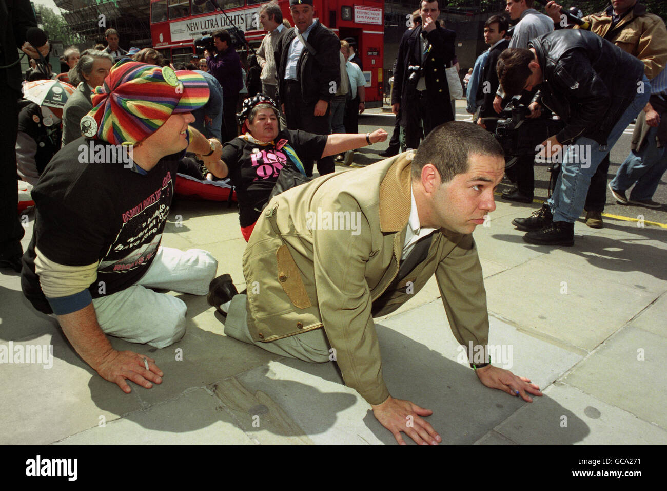 CRAWLING DISABLED PROTEST MP'S Stock Photo - Alamy
