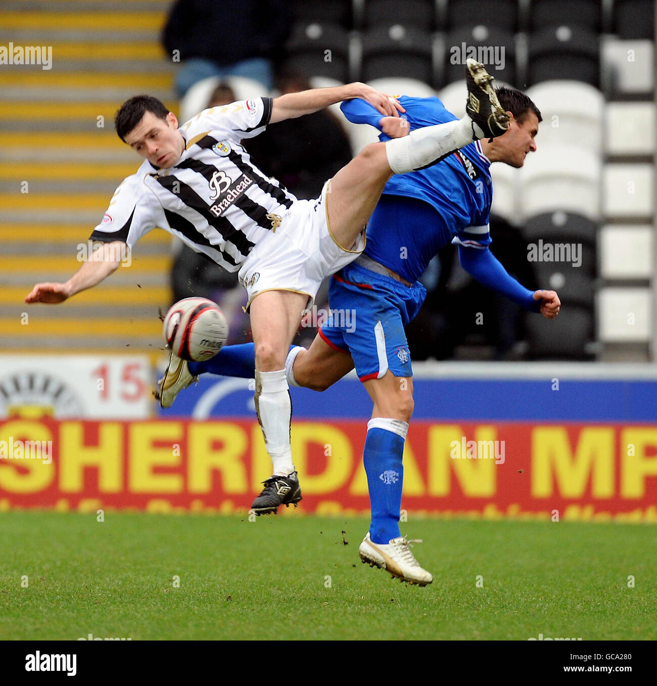 St Mirren's Steven Thomson (left) challenges Rangers' Lee McCulloch ...