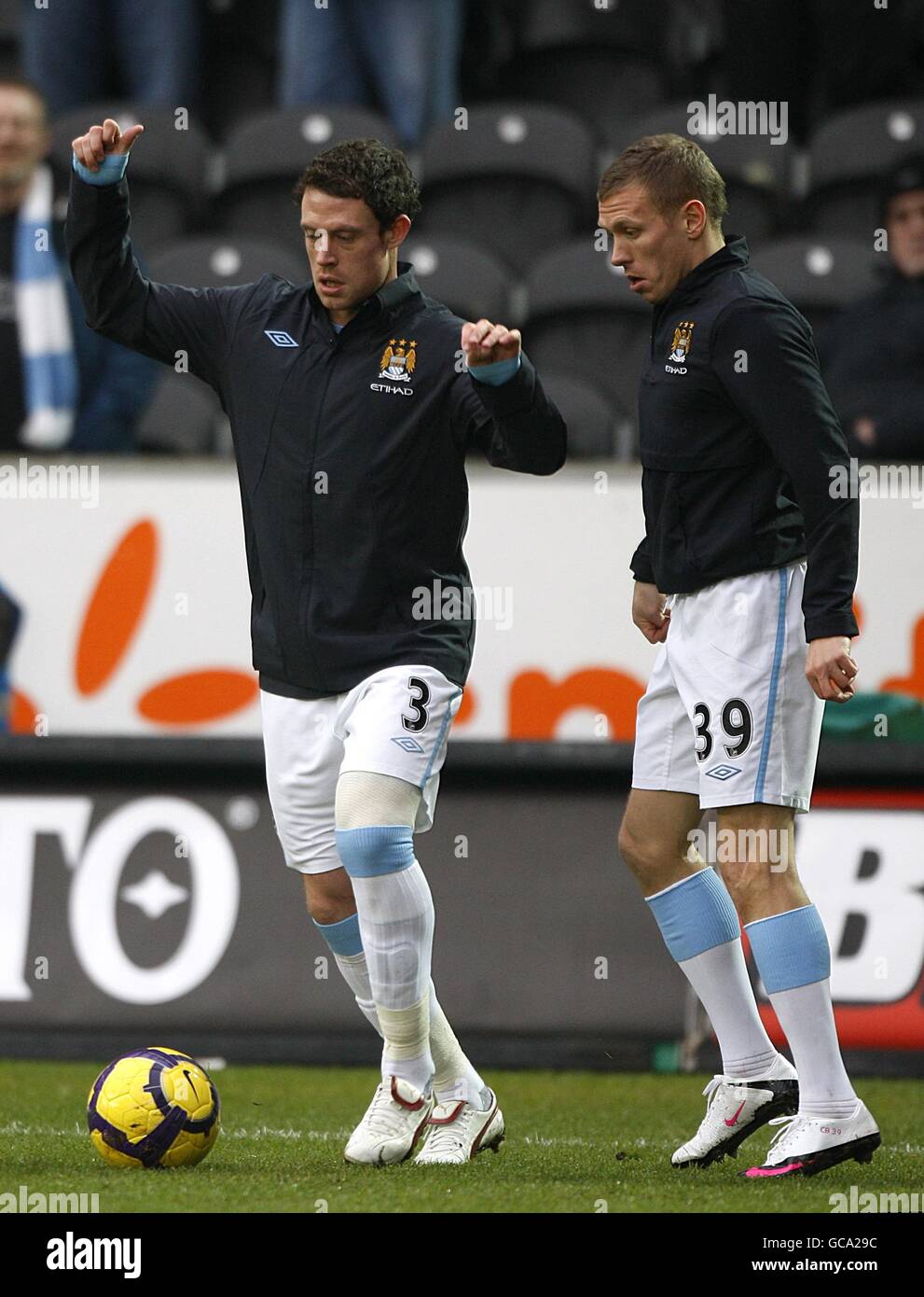 Manchester City's Wayne Bridge (left) and Craig Bellamy prior to kick ...