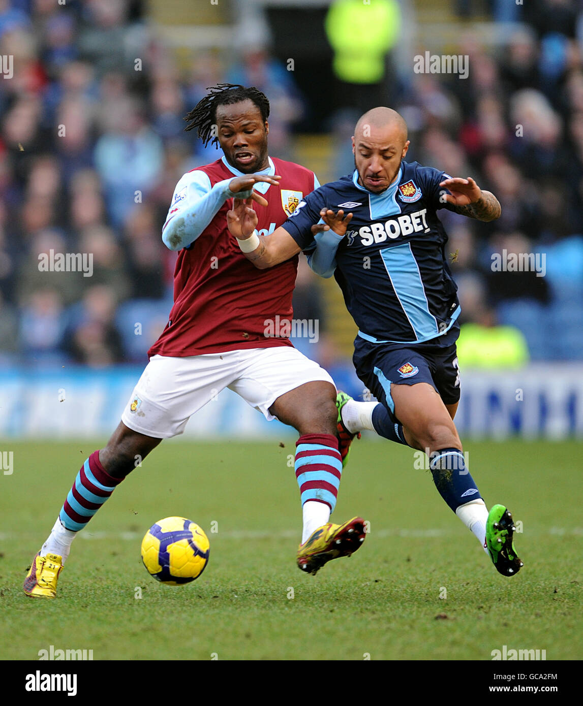 West Ham United's Julien Faubert (right) and Burnley's Andre Bikey ...
