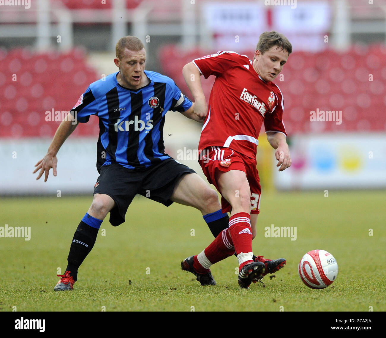 Charlton Athletic's Nicky Bailey challenges Swindon Town's Simon Ferry ...