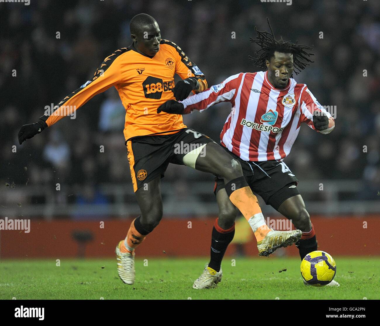 Wigan Athletic's Mohamed Diame (left) challenges Sunderland's Benjani ...