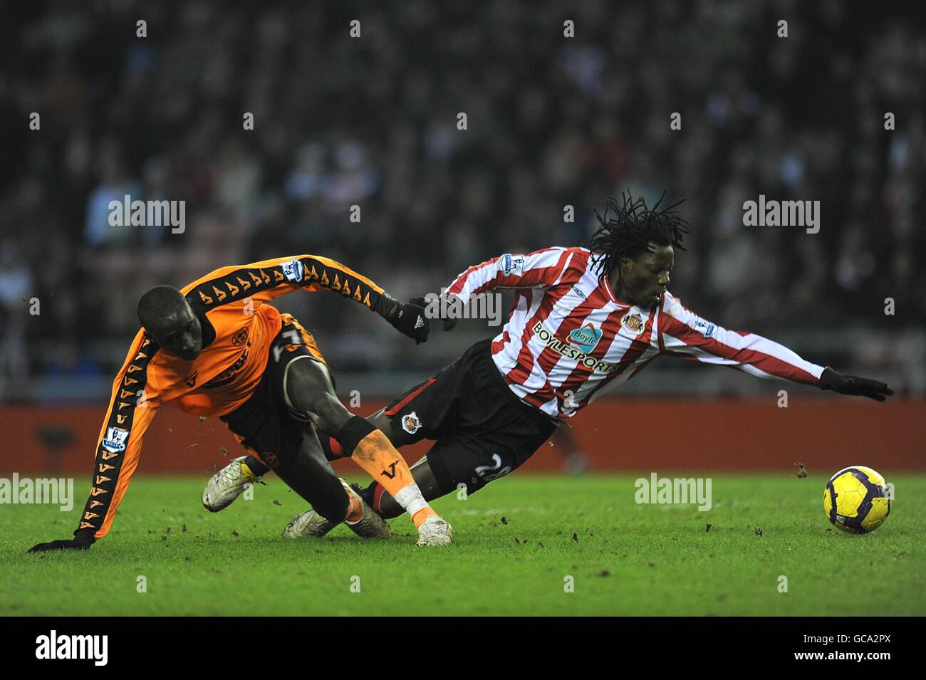 Wigan Athletic's Mohamed Diame (left) challenges Sunderland's Benjani ...