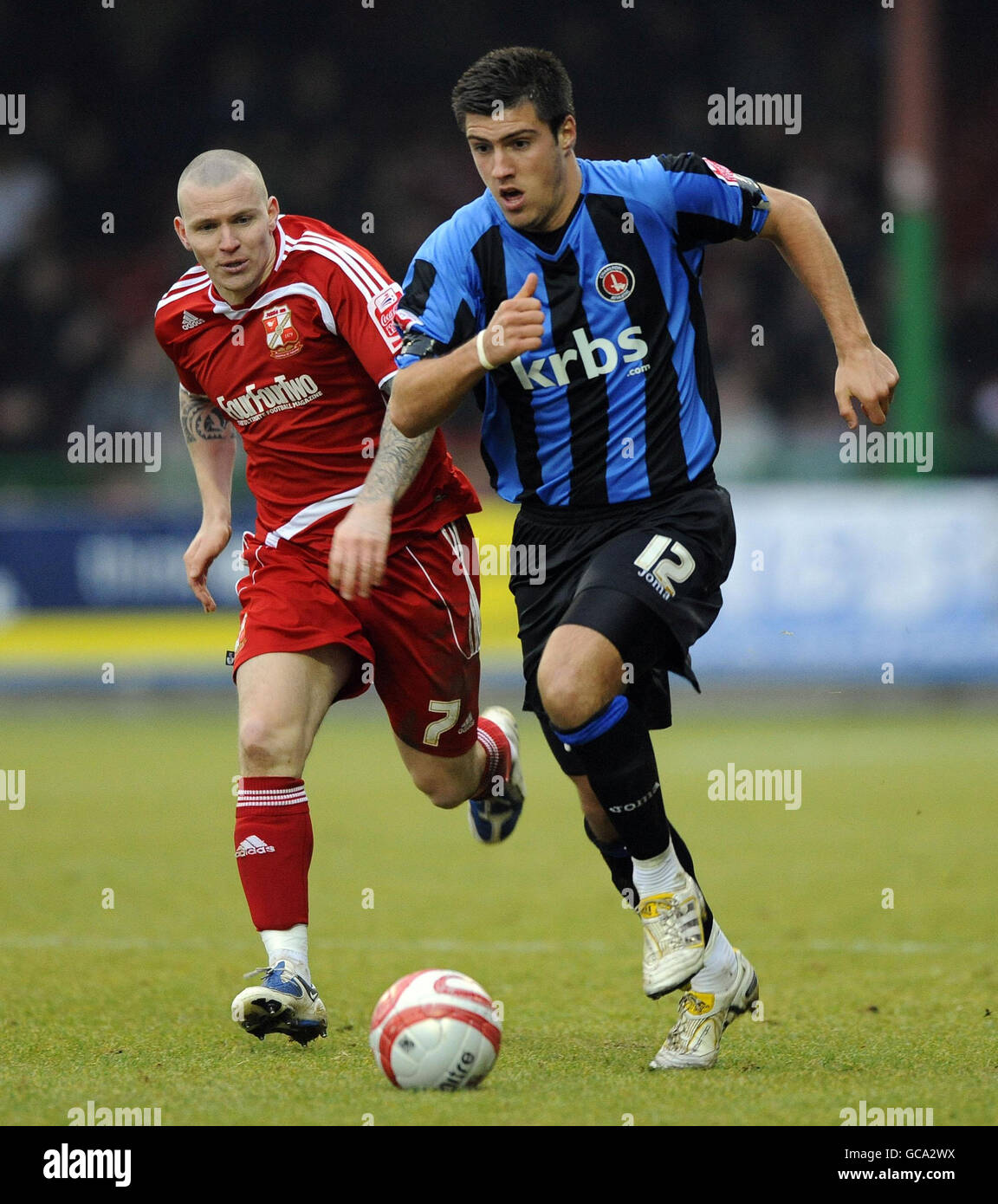 Swindon Town's Jon-Paul McGovern and Charlton Athletic's Grant Basey ...