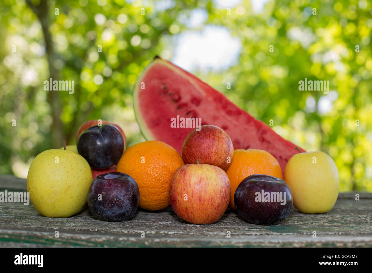 fruits in wooden table, outdoor Stock Photo - Alamy