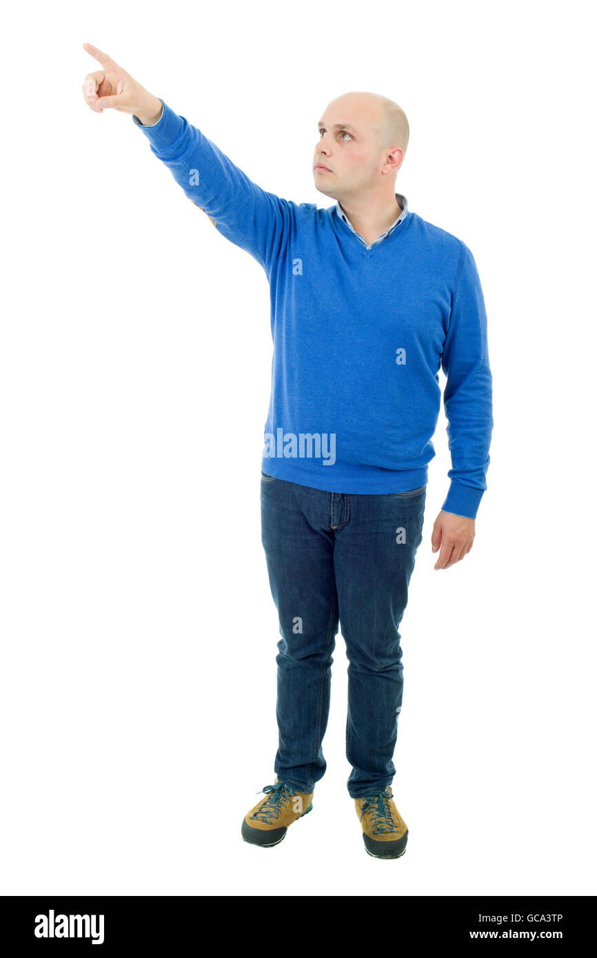 young casual man full body, pointing, isolated on a white background ...