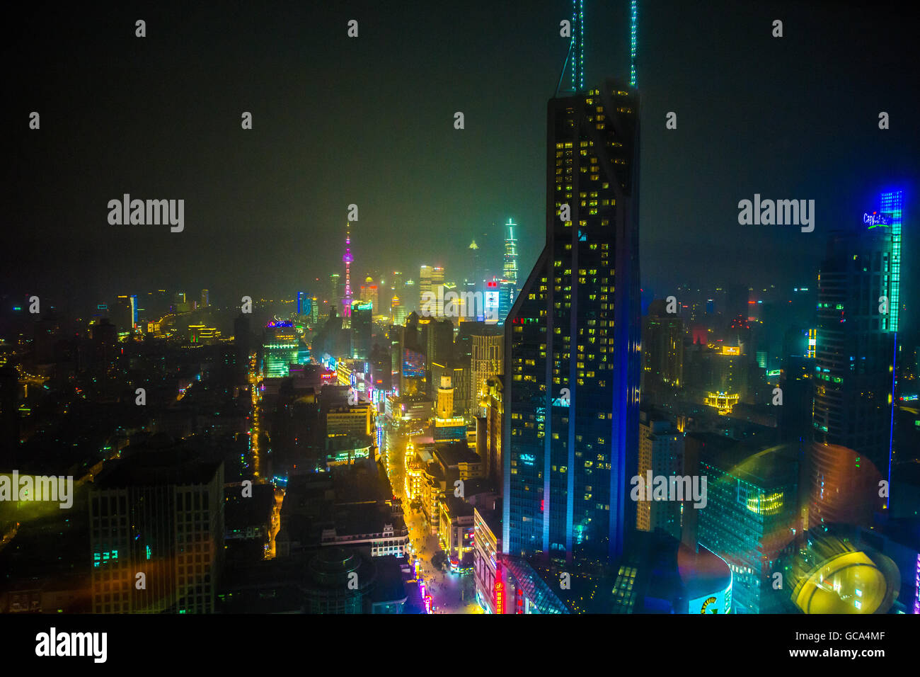 SHANGHAI CHINA Neon signs lit on streets. main shopping district of the ...