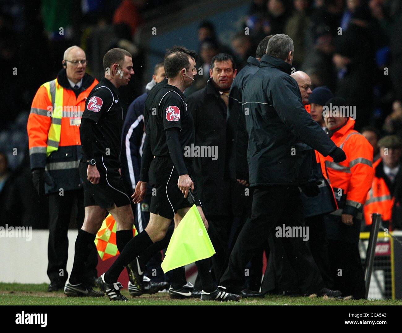 Hull City manager Phil Brown (center) waits for referee Lee Probert at ...