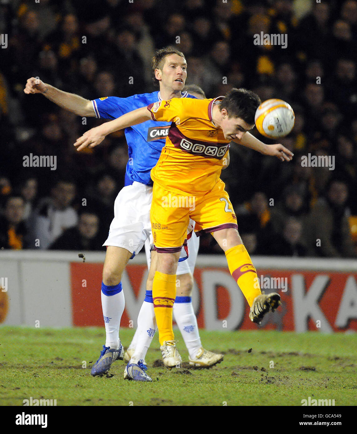 Motherwell's Tom Hateley and Rangers Kirk Broadfoot battle for the ball ...