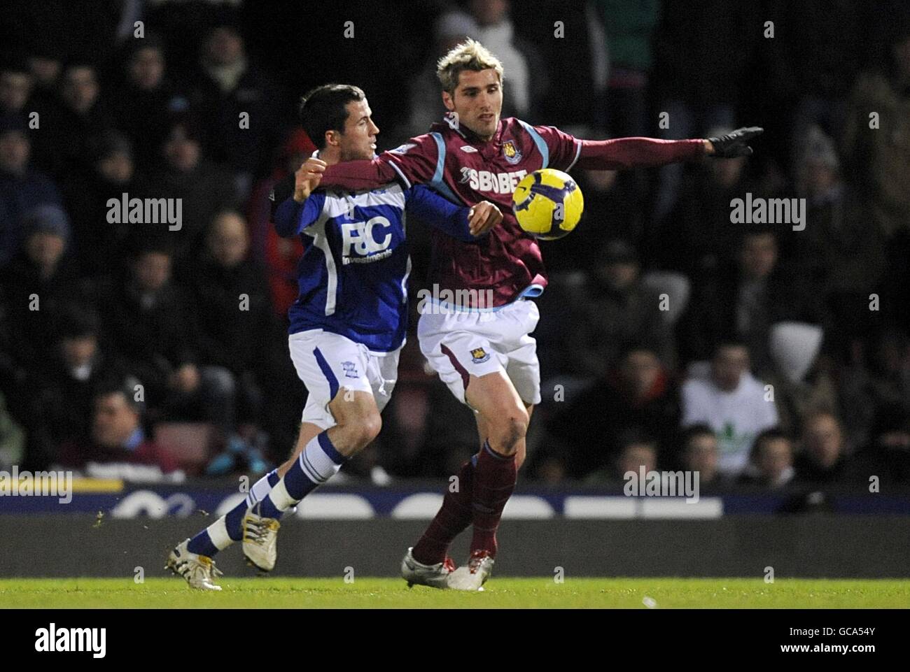 West Ham United's Valon Behrami (right) and Birmingham City's Keith ...