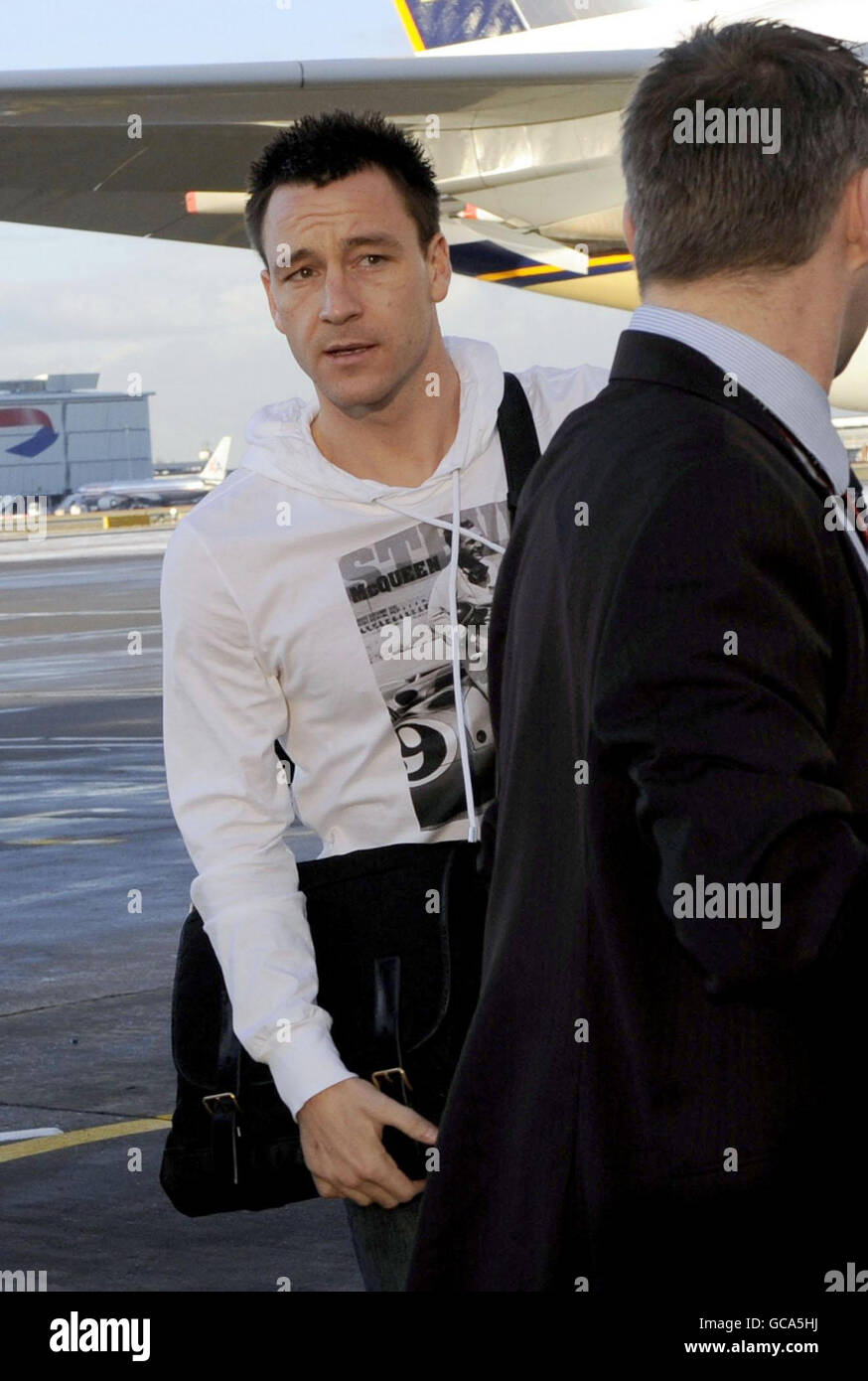 Former England football captain John Terry boards an Emirates plane at ...