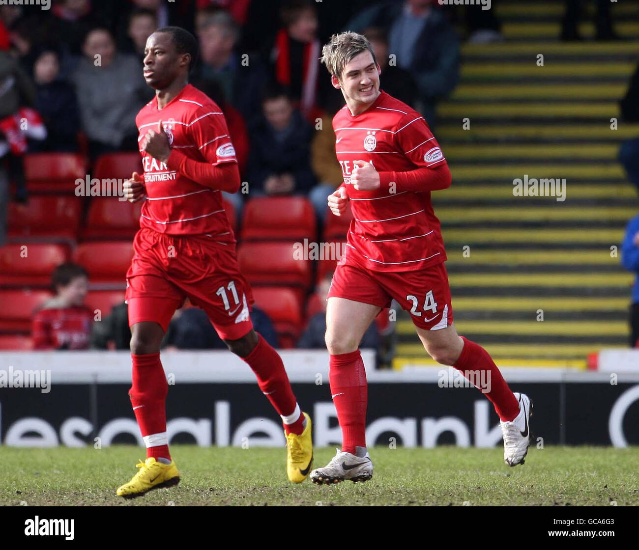 Abedeen's Michael Paton (right) celebrates scoring during the ...
