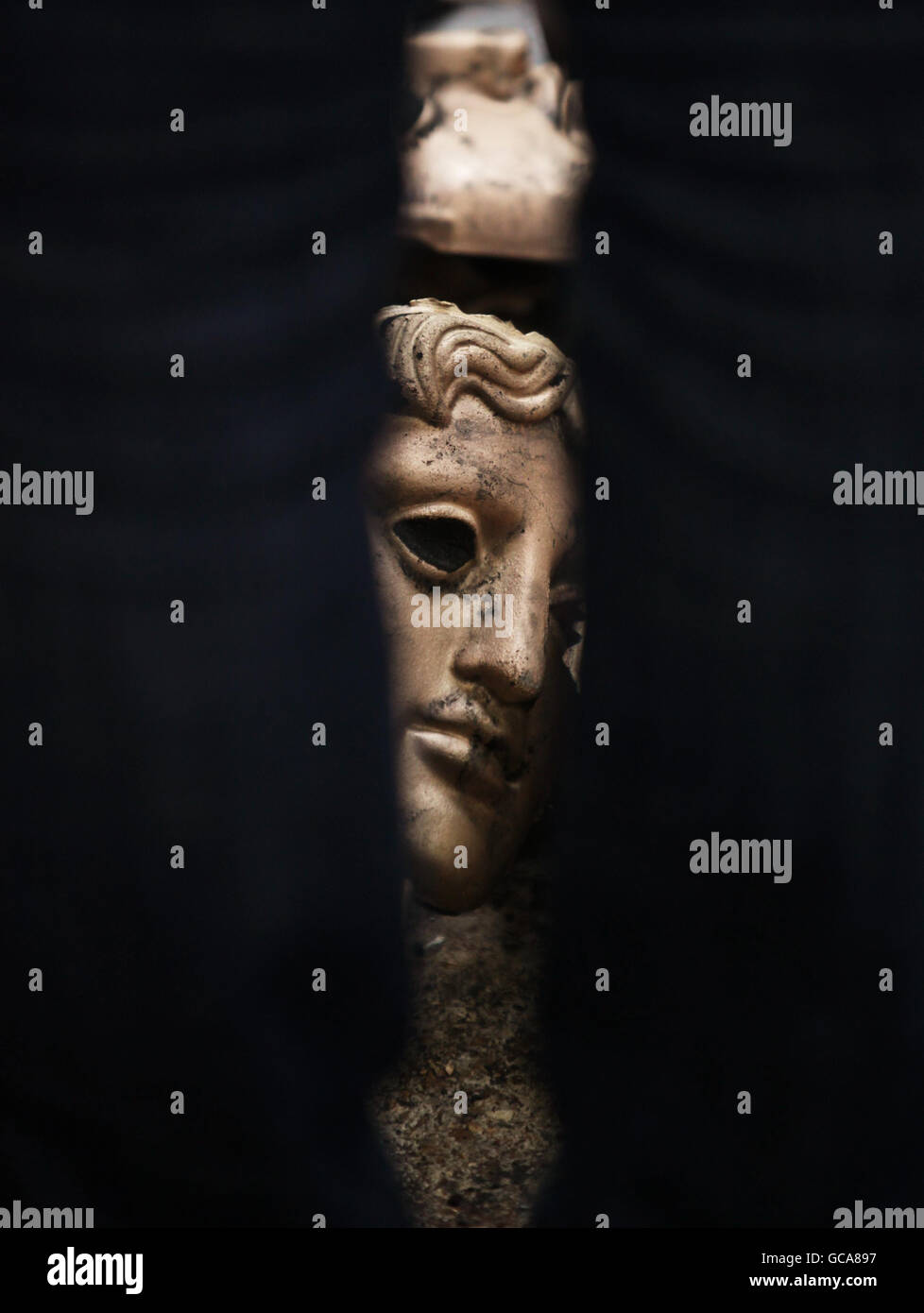 Orange BAFTA award mask casting Stock Photo - Alamy