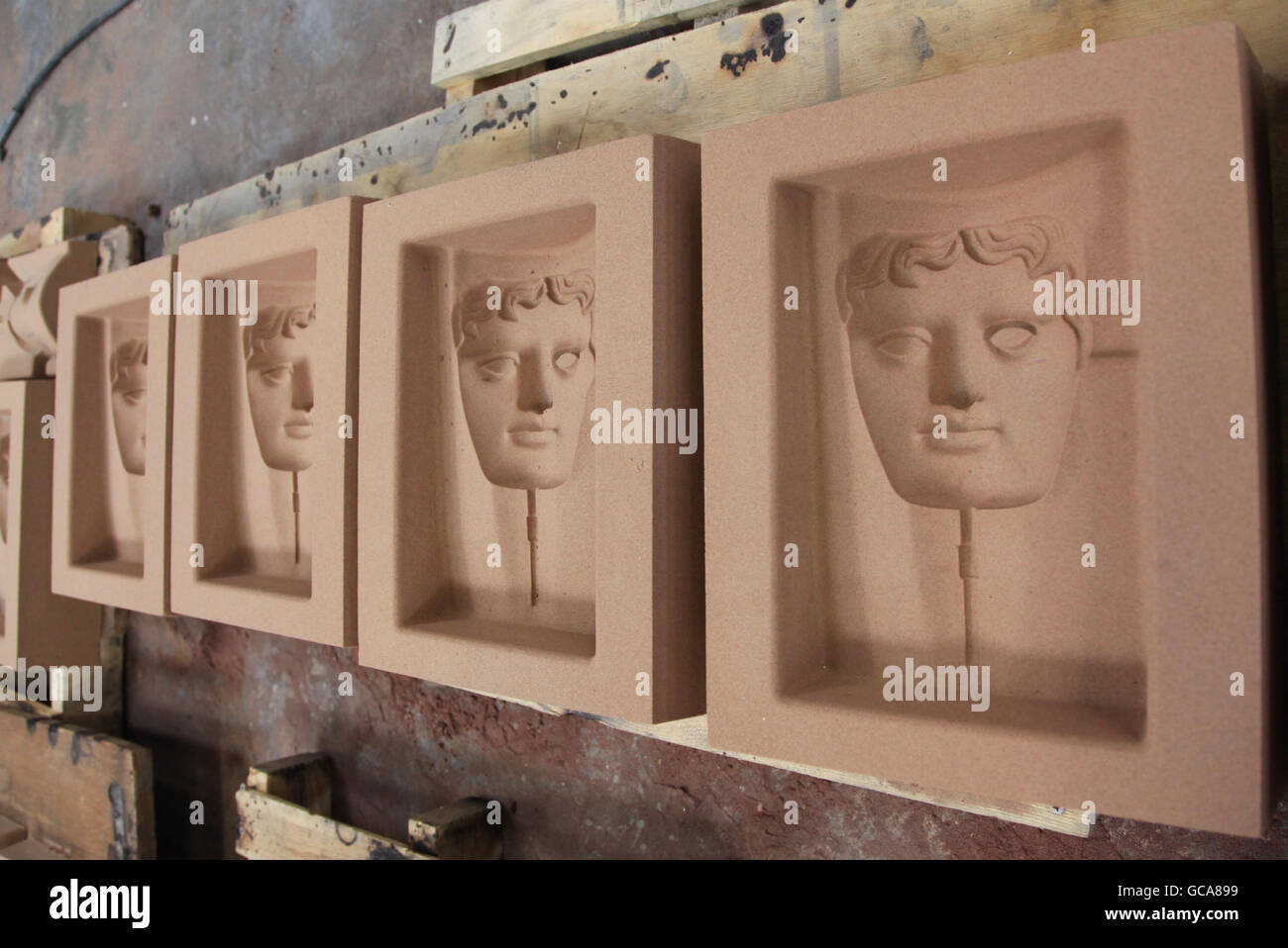 Orange BAFTA award mask casting Stock Photo - Alamy