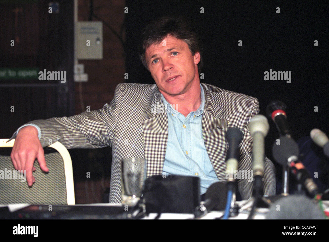 H s seated behind microphones hi-res stock photography and images - Alamy