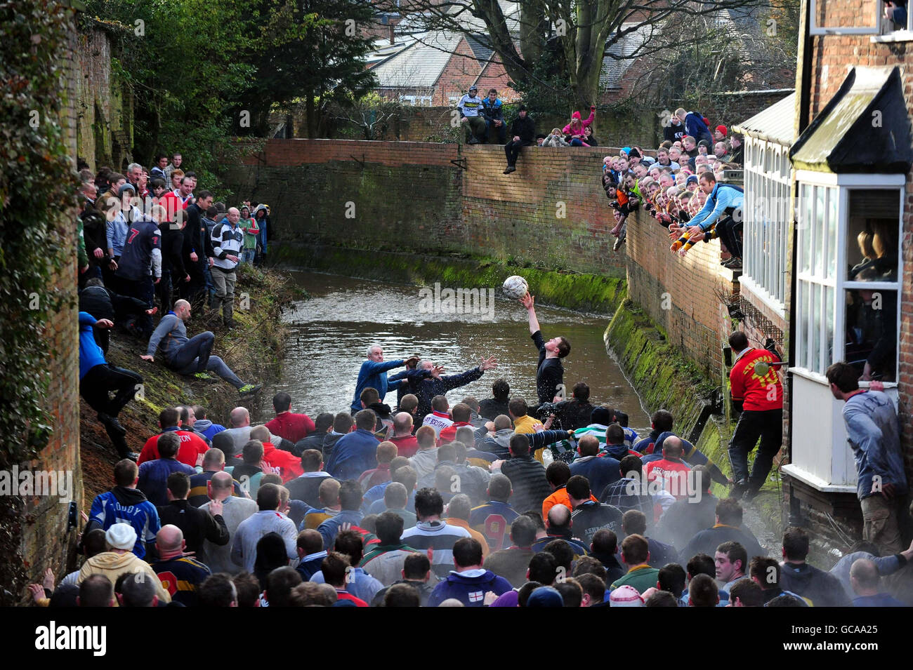 Shrove Tuesday. Participants play in the Ashbourne Shrovetide football ...