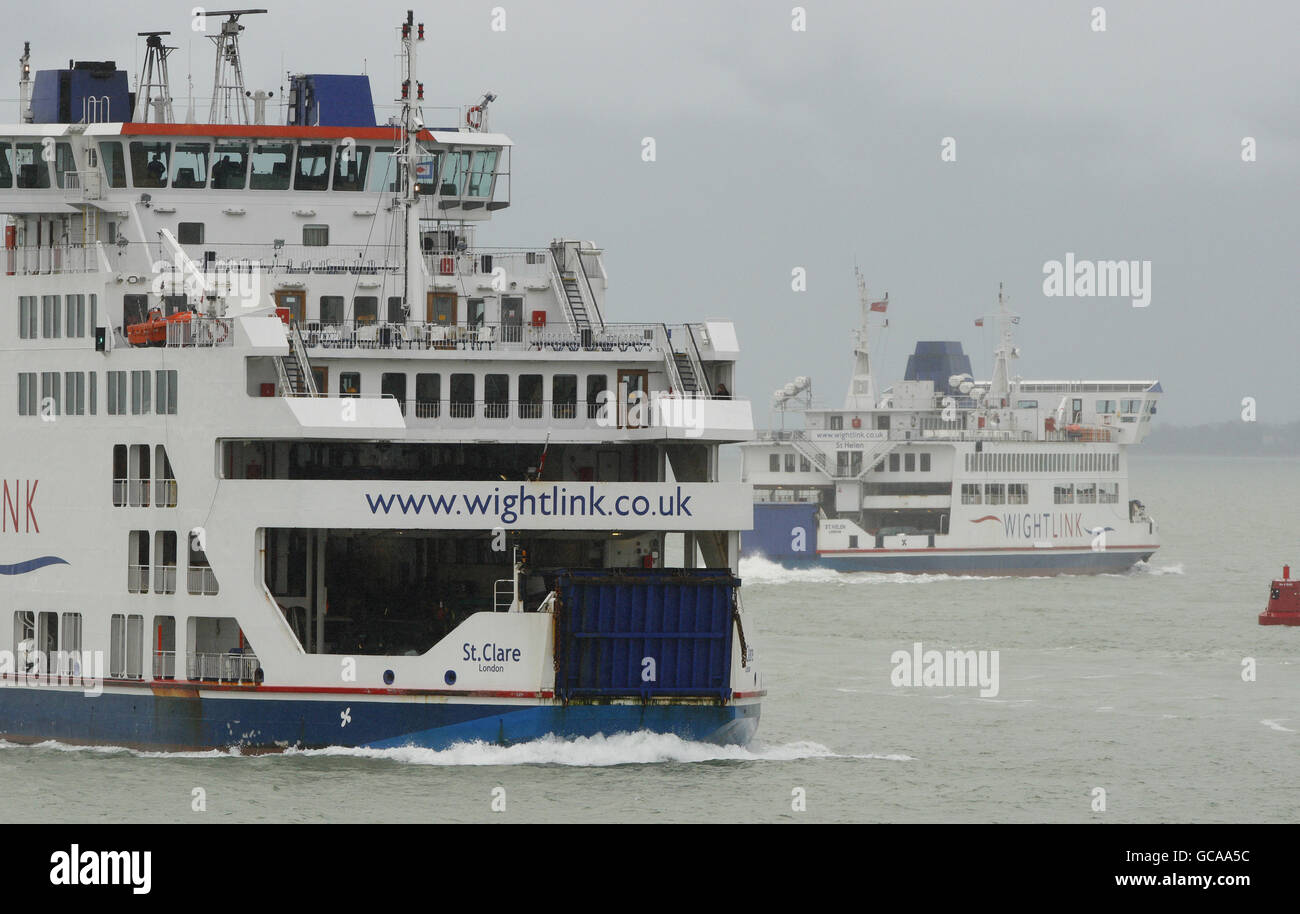 The Wightlink car ferry St Clare (left) passes the St Helen as she ...