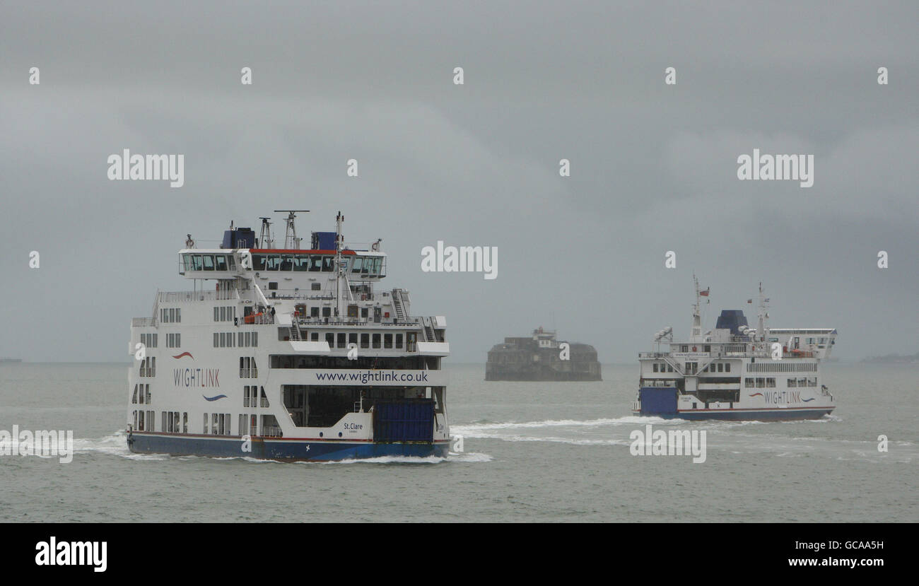 The Wightlink car ferry St Clare (left) passes the St Helen as she ...