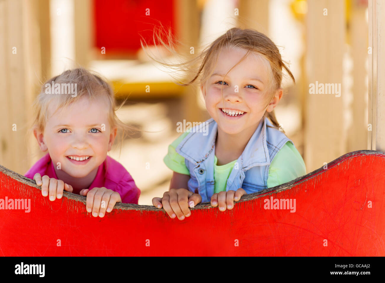 happy kids on children playground Stock Photo - Alamy