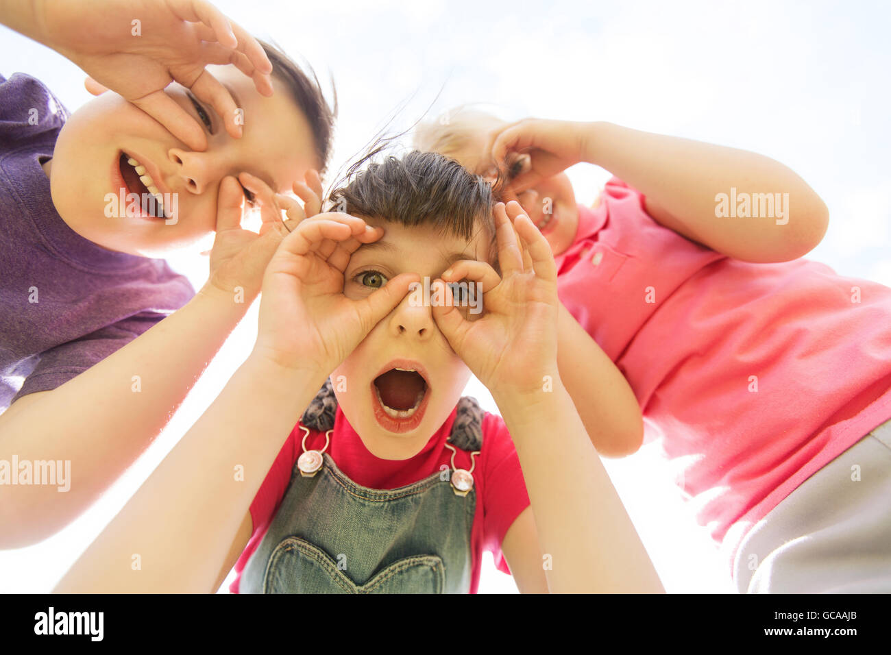 group of kids having fun and making faces outdoors Stock Photo - Alamy
